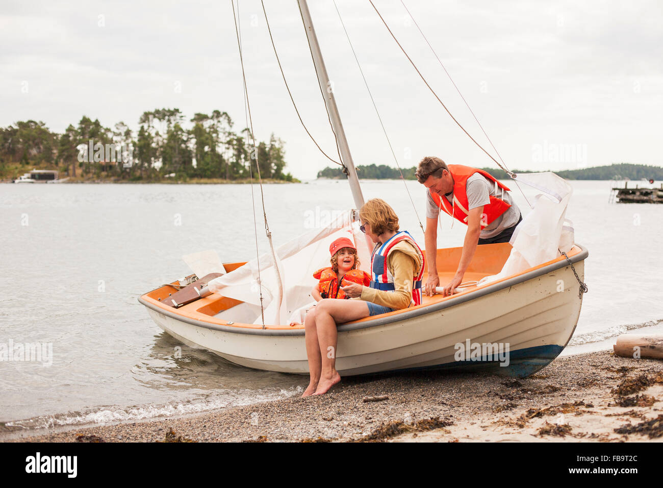 Family sailboat child lifejacket hi-res stock photography and images ...