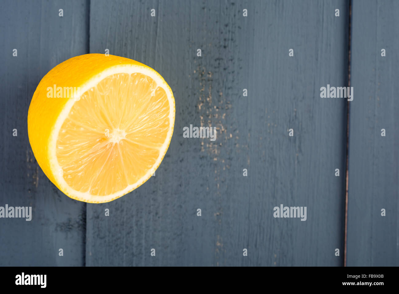 Fresh Yellow Lemon Slice On Wood Table Stock Photo - Alamy