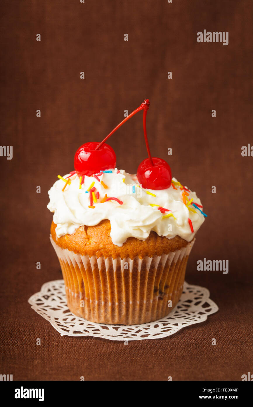 Tasty cupcake with cherry Stock Photo - Alamy