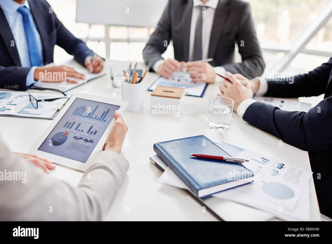 Business people working in team at the table Stock Photo - Alamy