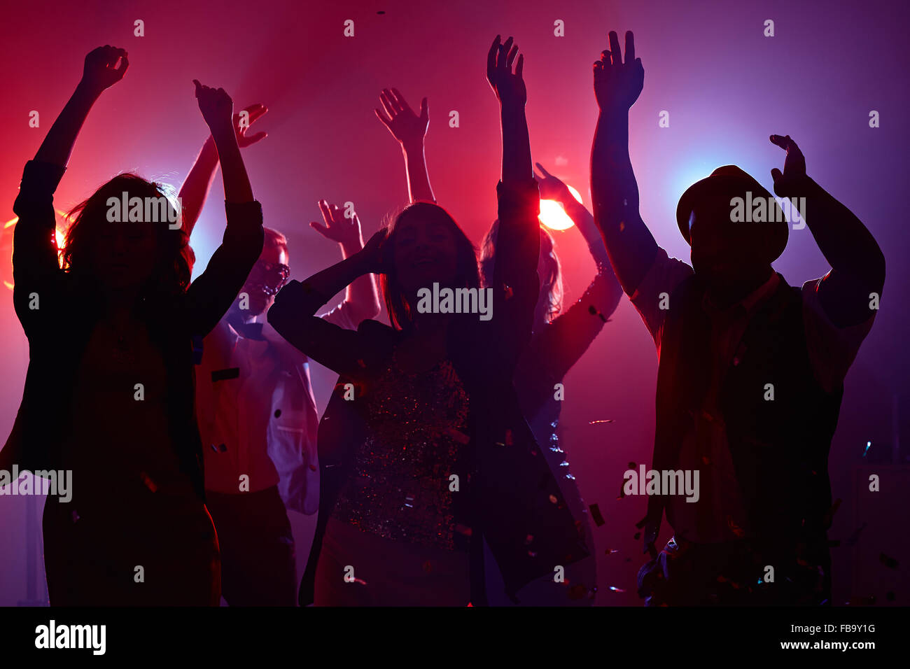 Young people raising their arms in dance Stock Photo - Alamy