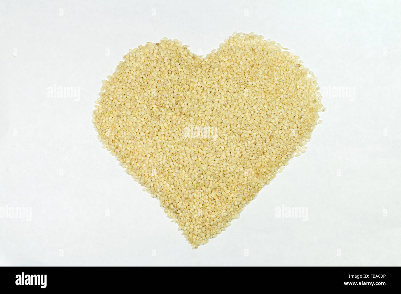 Sesame Seeds in the shape of a heart Stock Photo - Alamy