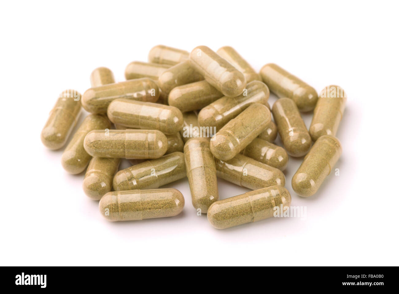 Capsules of herbal medicine isolated on white Stock Photo - Alamy