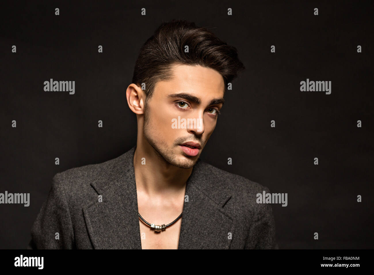 Model man isolated on black background Stock Photo - Alamy