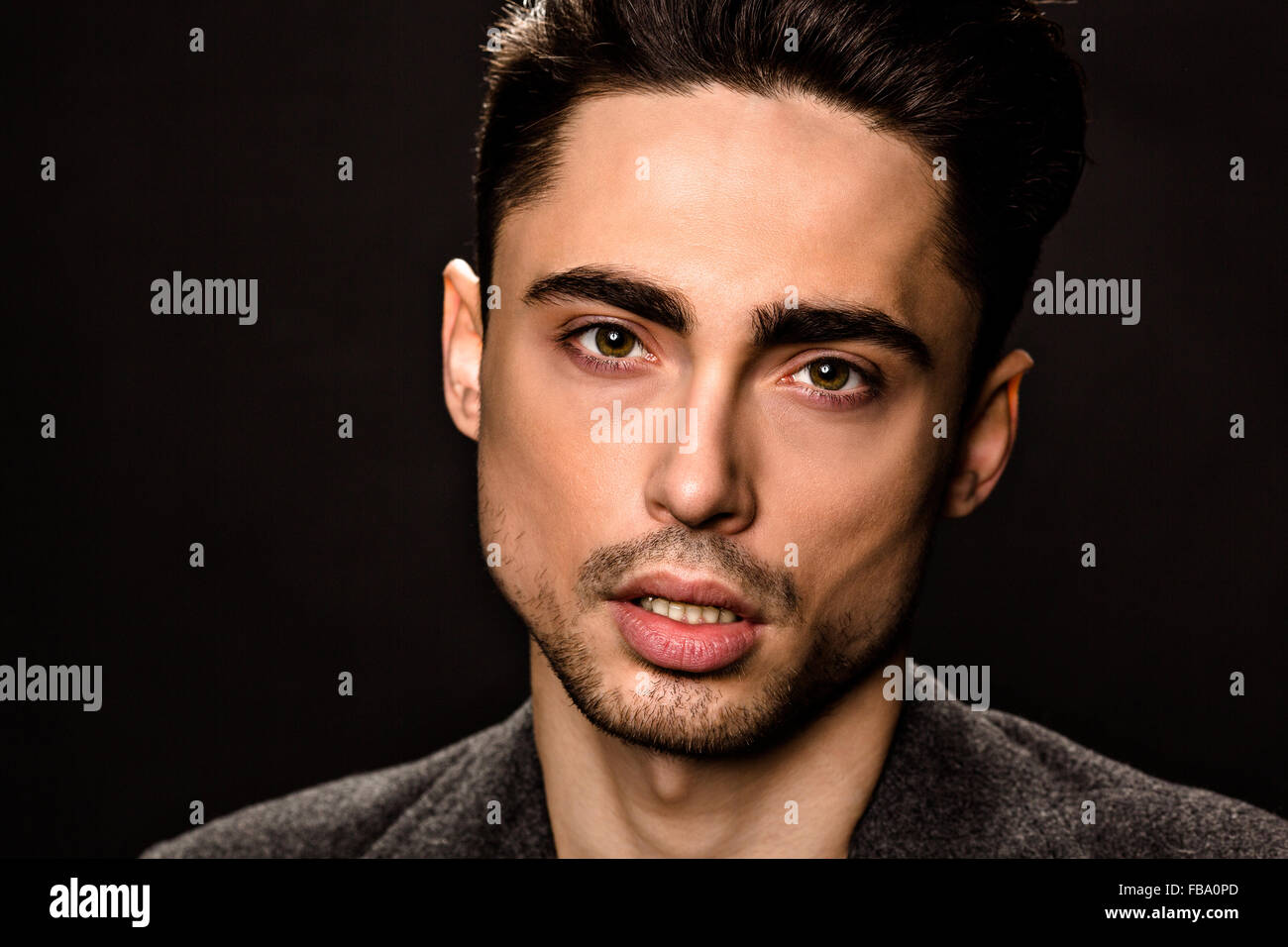 Portrait of model man's face in studio Stock Photo - Alamy
