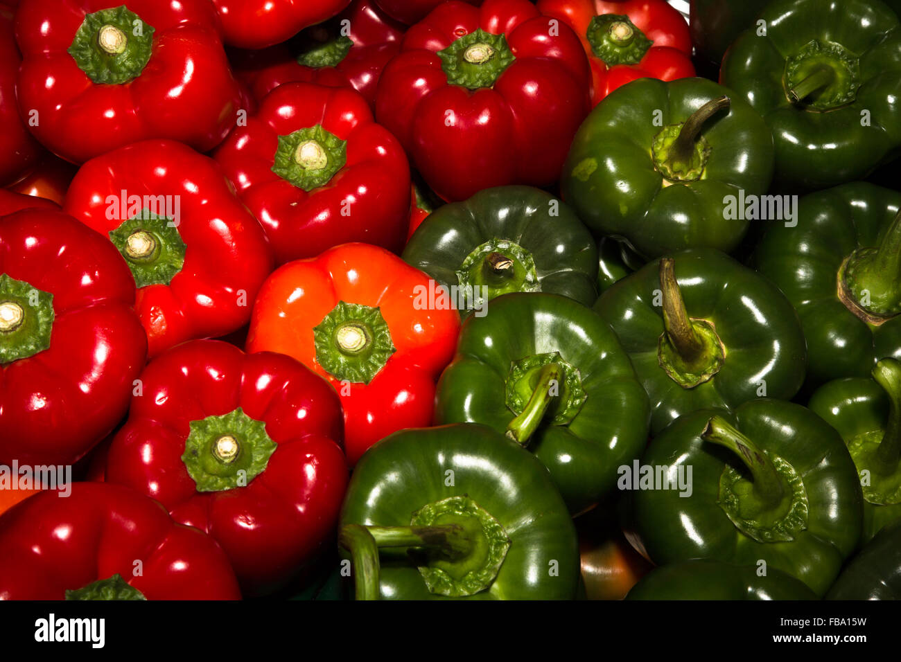 A Grocers shop display of Red and Green Bell Peppers Stock Photo - Alamy