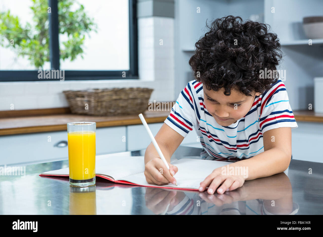 Cute child doing homework Stock Photo - Alamy