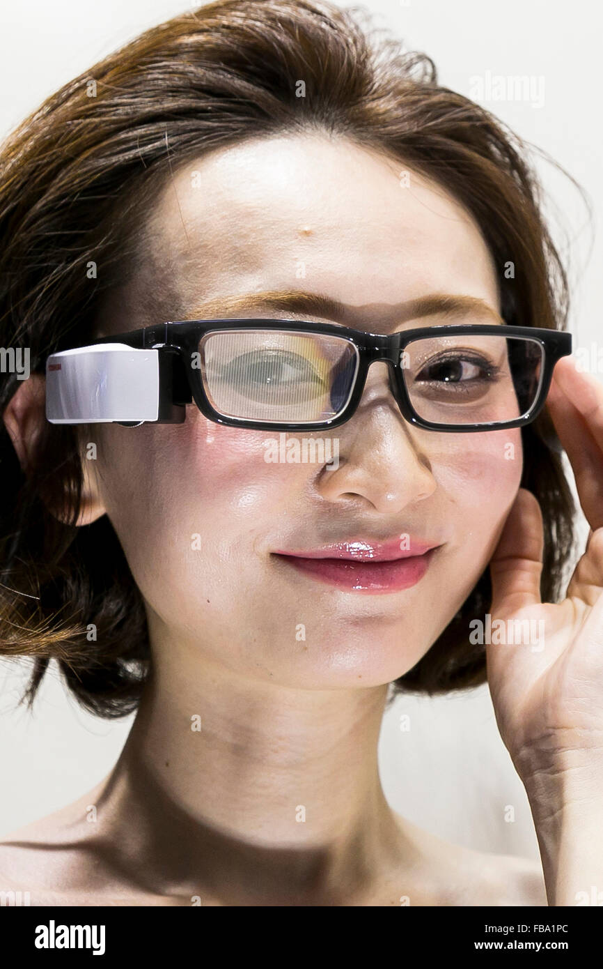 Tokyo, Japan. 13th January, 2016. An exhibitor wears a Toshiba smart ...