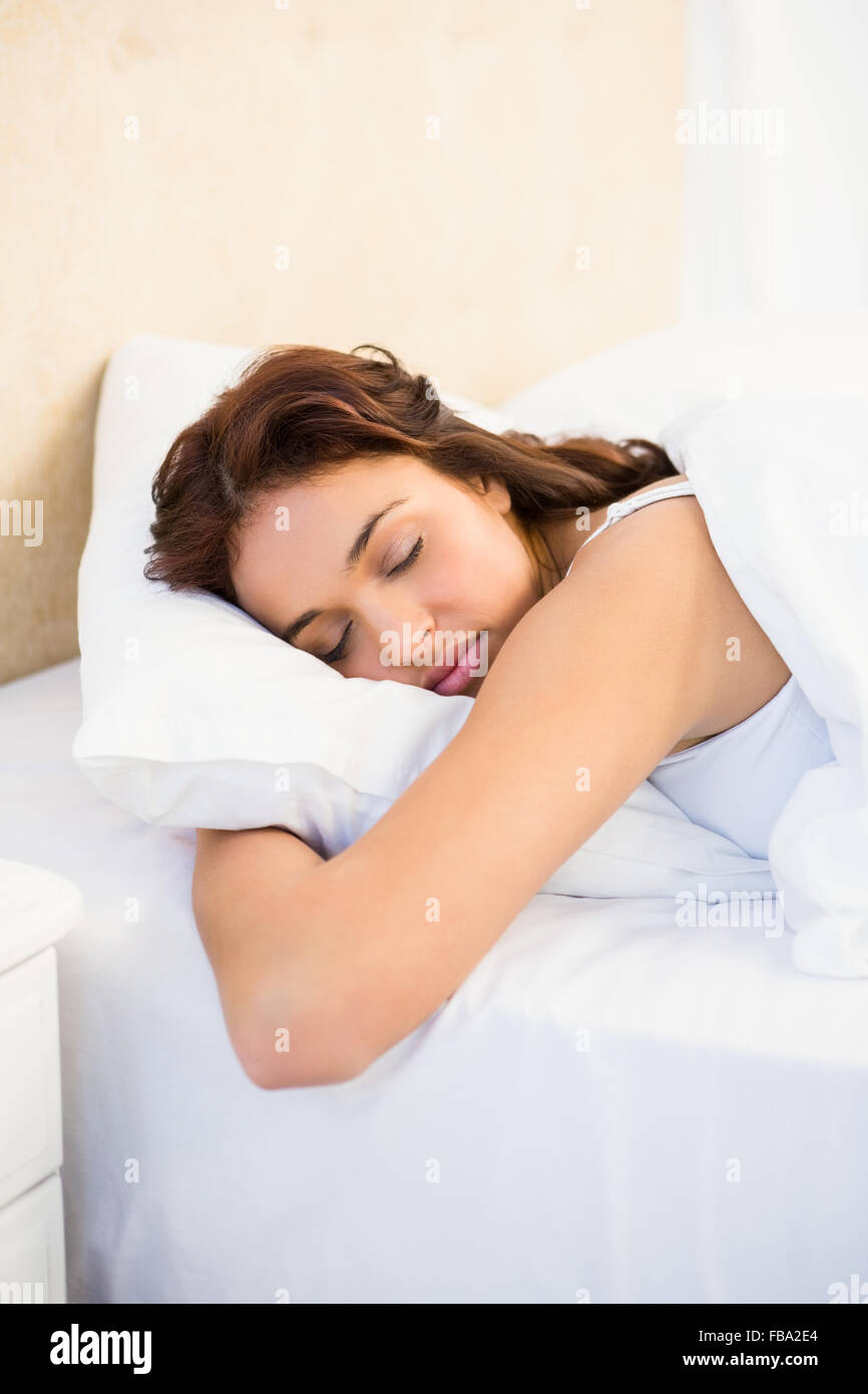 Sleepy woman in her bed Stock Photo - Alamy