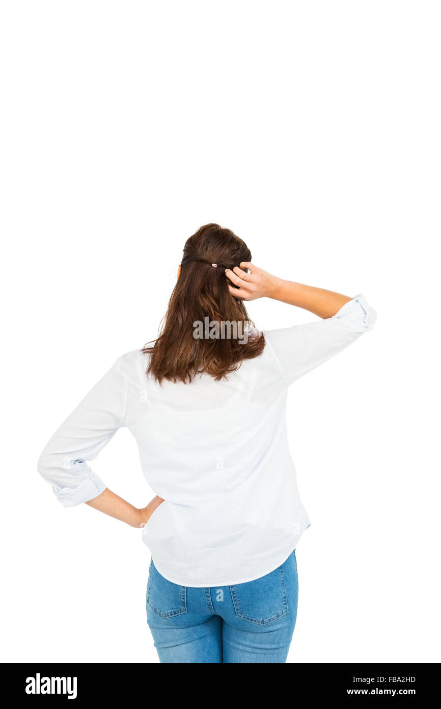 Rear view of woman scratching her head Stock Photo - Alamy