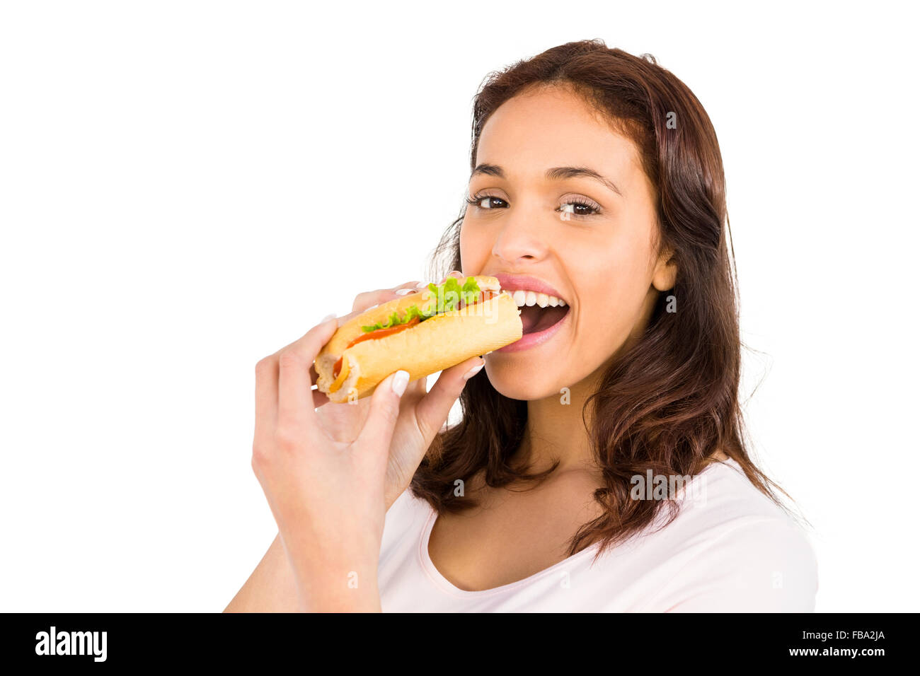 Smiling woman eating sandwich Stock Photo - Alamy