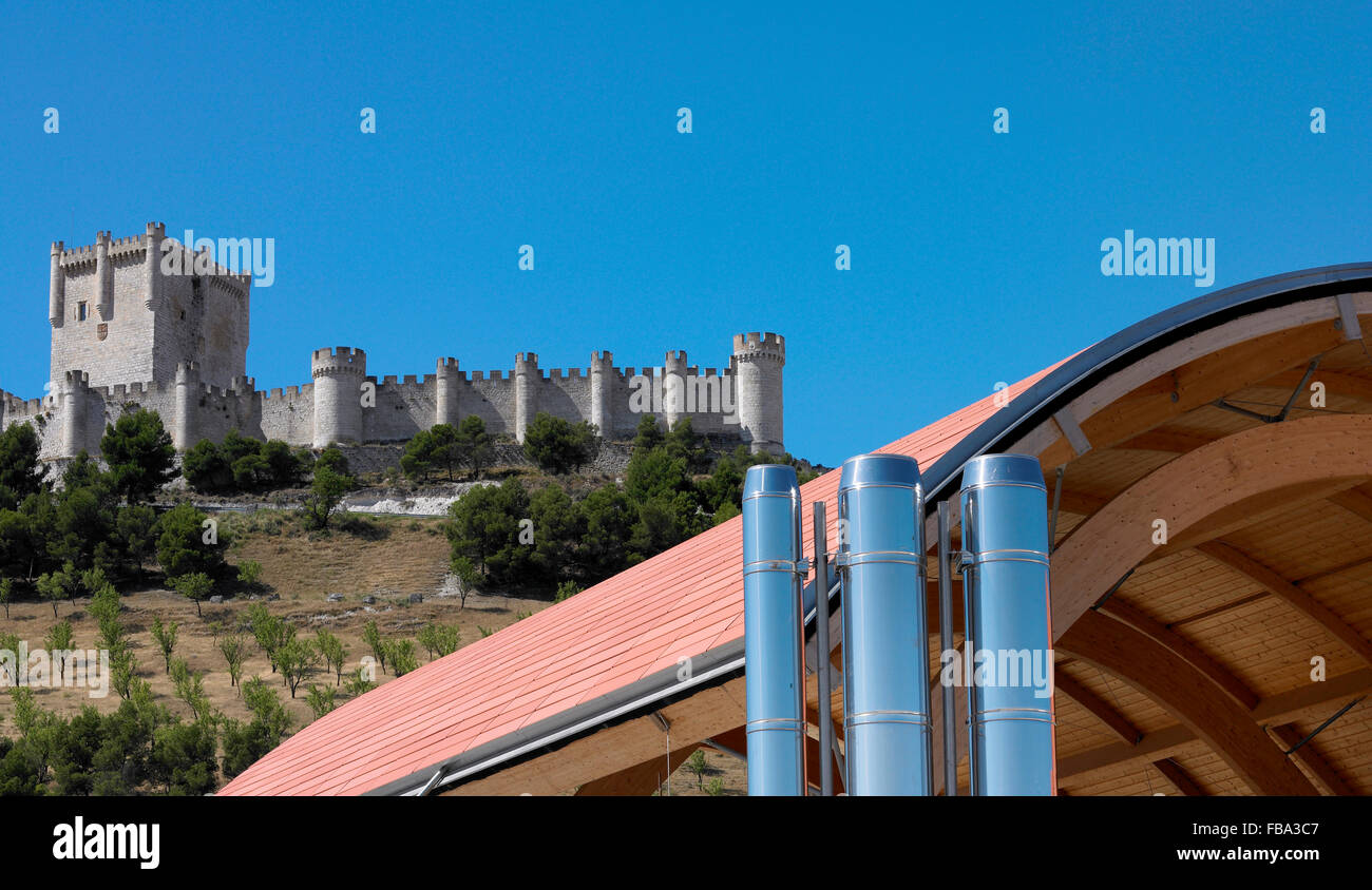New modern building against old spanish castle Stock Photo - Alamy