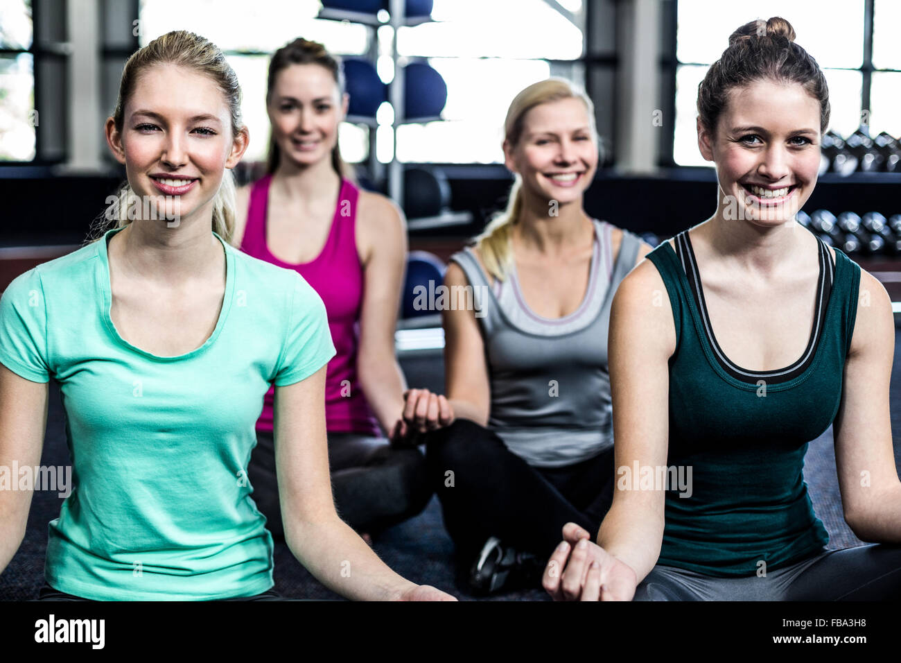 Fit group doing yoga Stock Photo - Alamy
