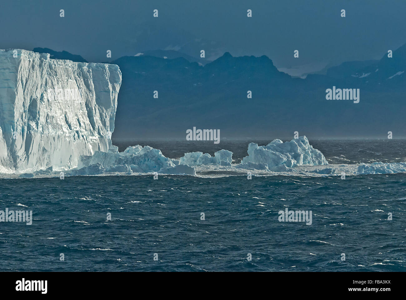Melting Antarctic ice sheet. One of 3 images of calving ice cliff Stock ...