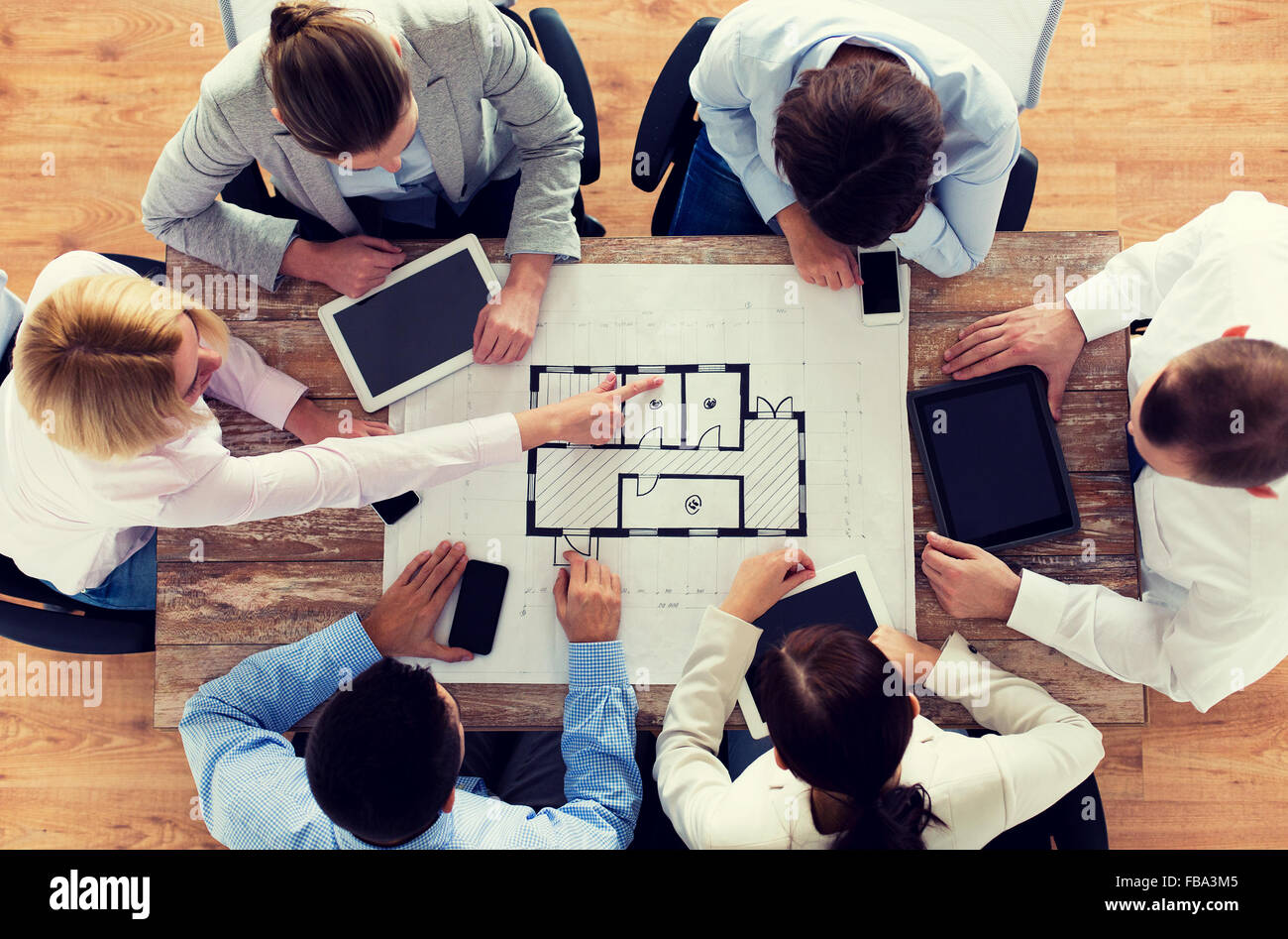 business team with blueprint and gadgets Stock Photo - Alamy