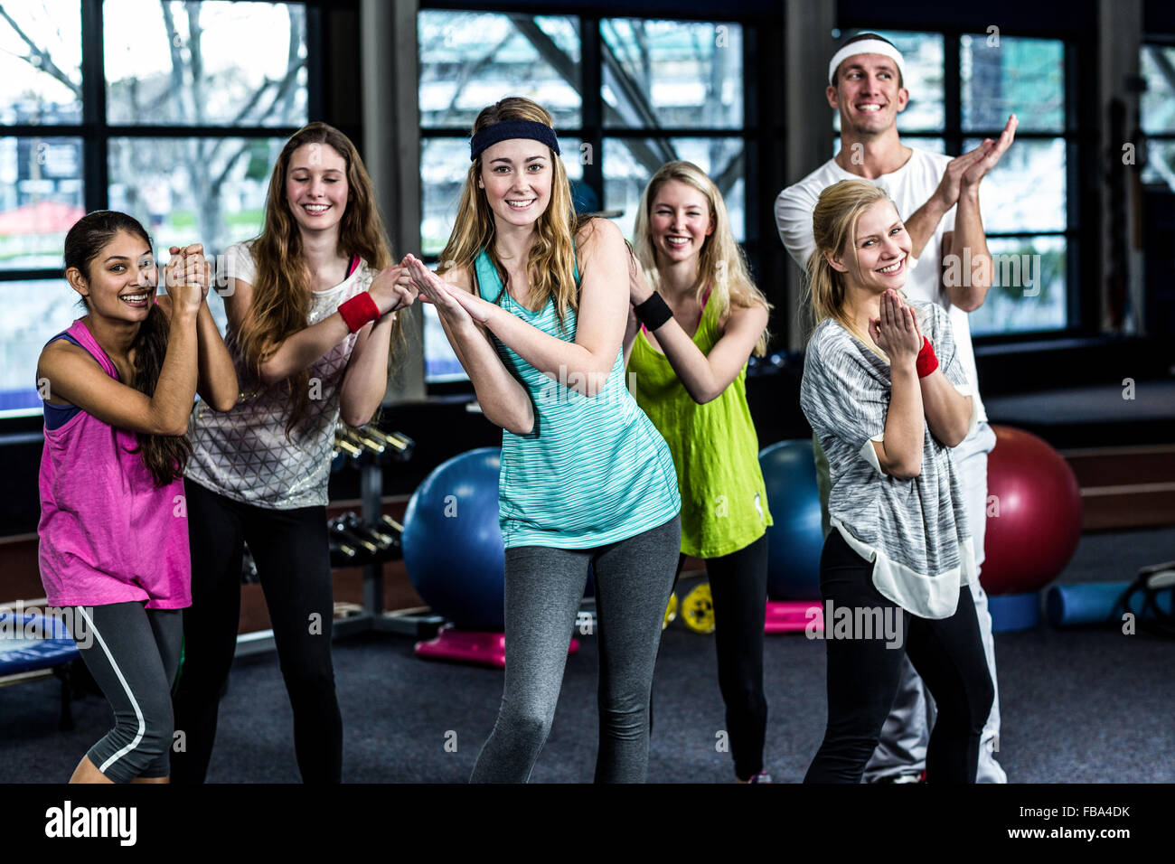 Smiling dancer group posing together Stock Photo - Alamy