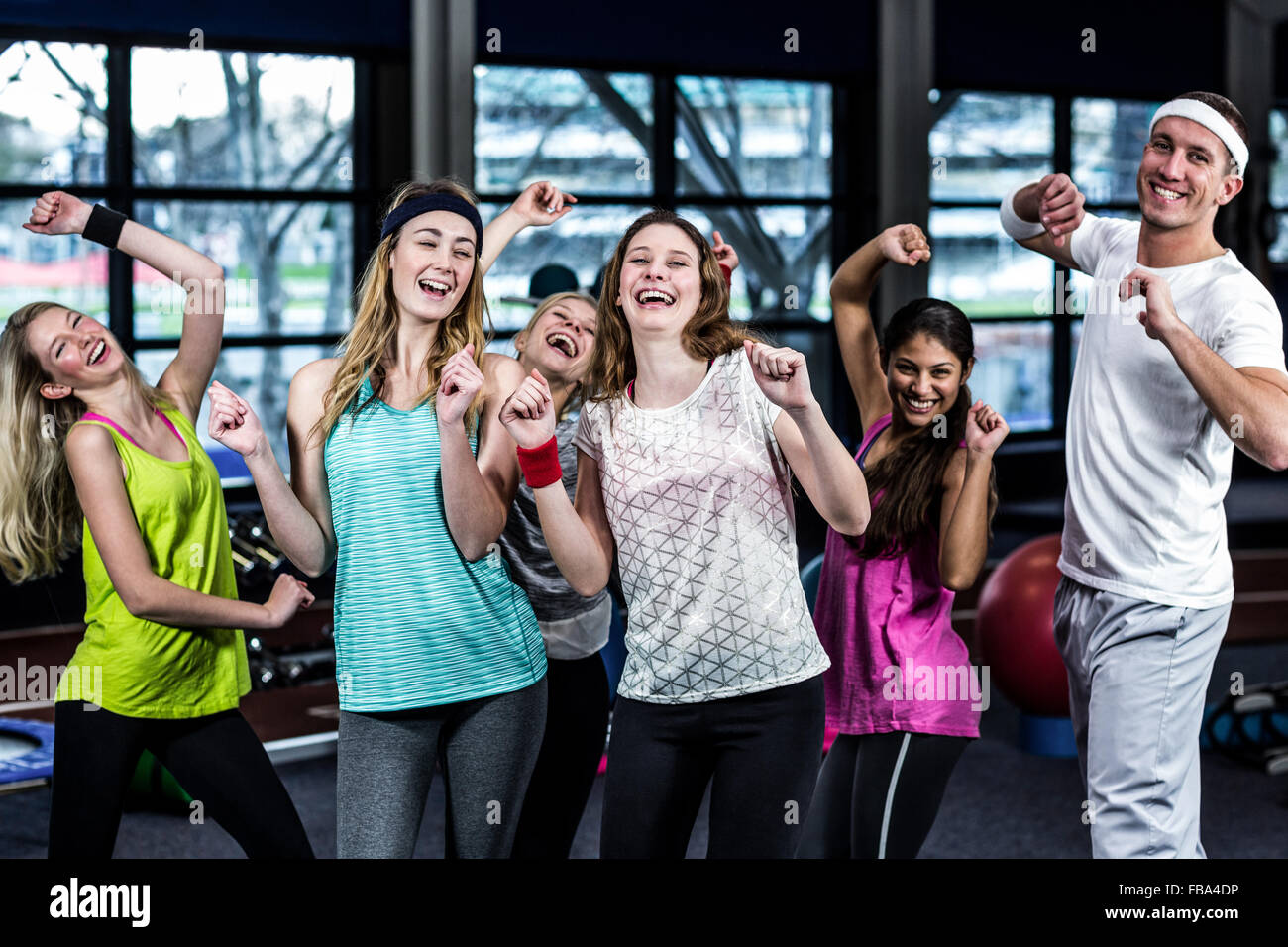 Fit group dancing and smiling Stock Photo - Alamy
