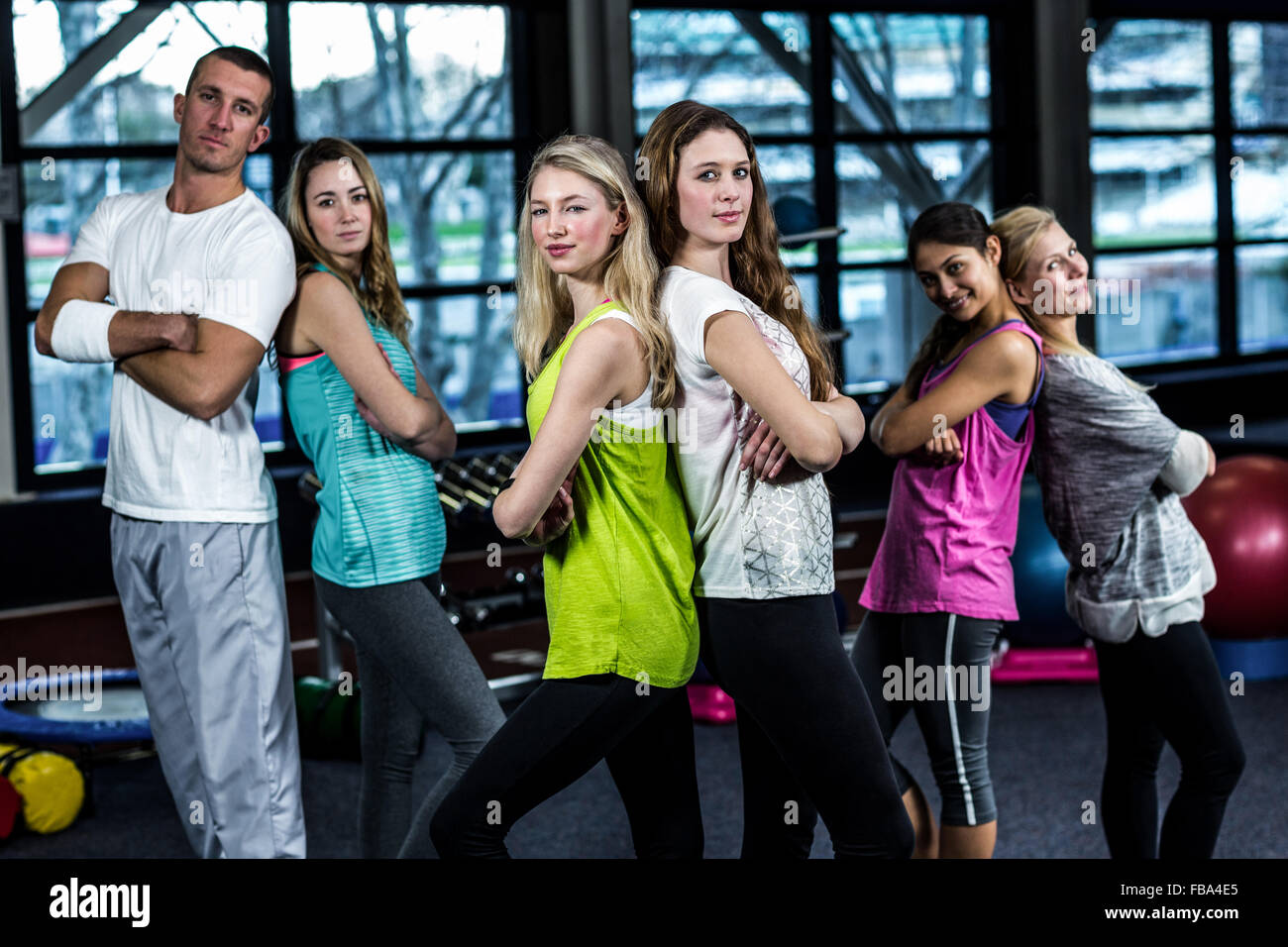Dancer group posing back to back Stock Photo - Alamy