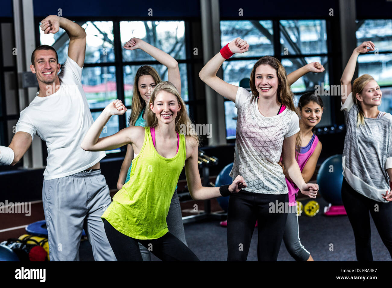 Fit group dancing and smiling Stock Photo - Alamy