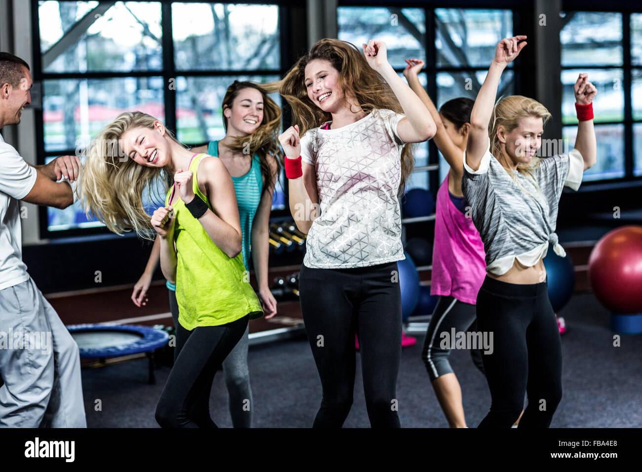 Fit group dancing and smiling Stock Photo - Alamy