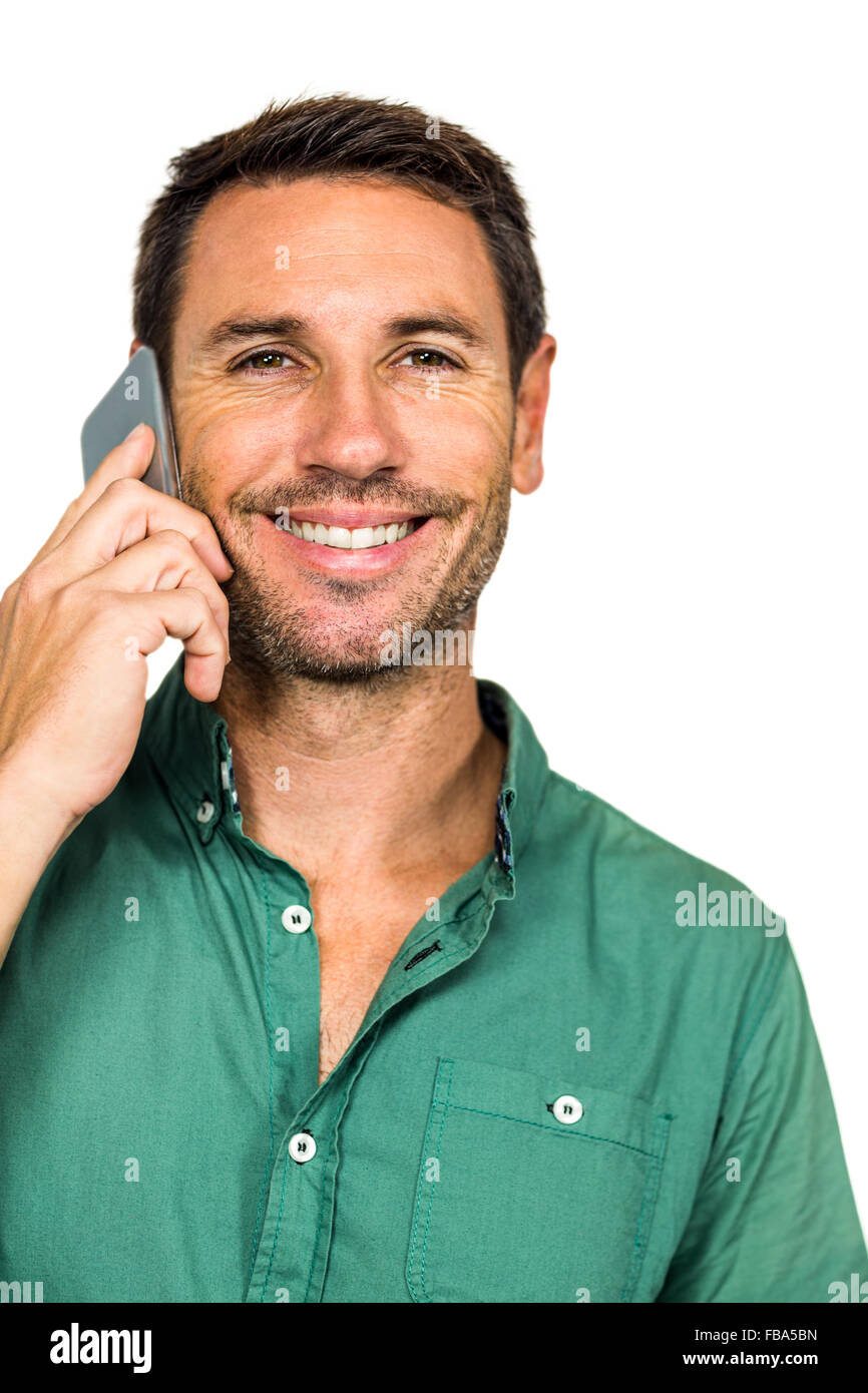 Man on phone call smiling at camera Stock Photo - Alamy
