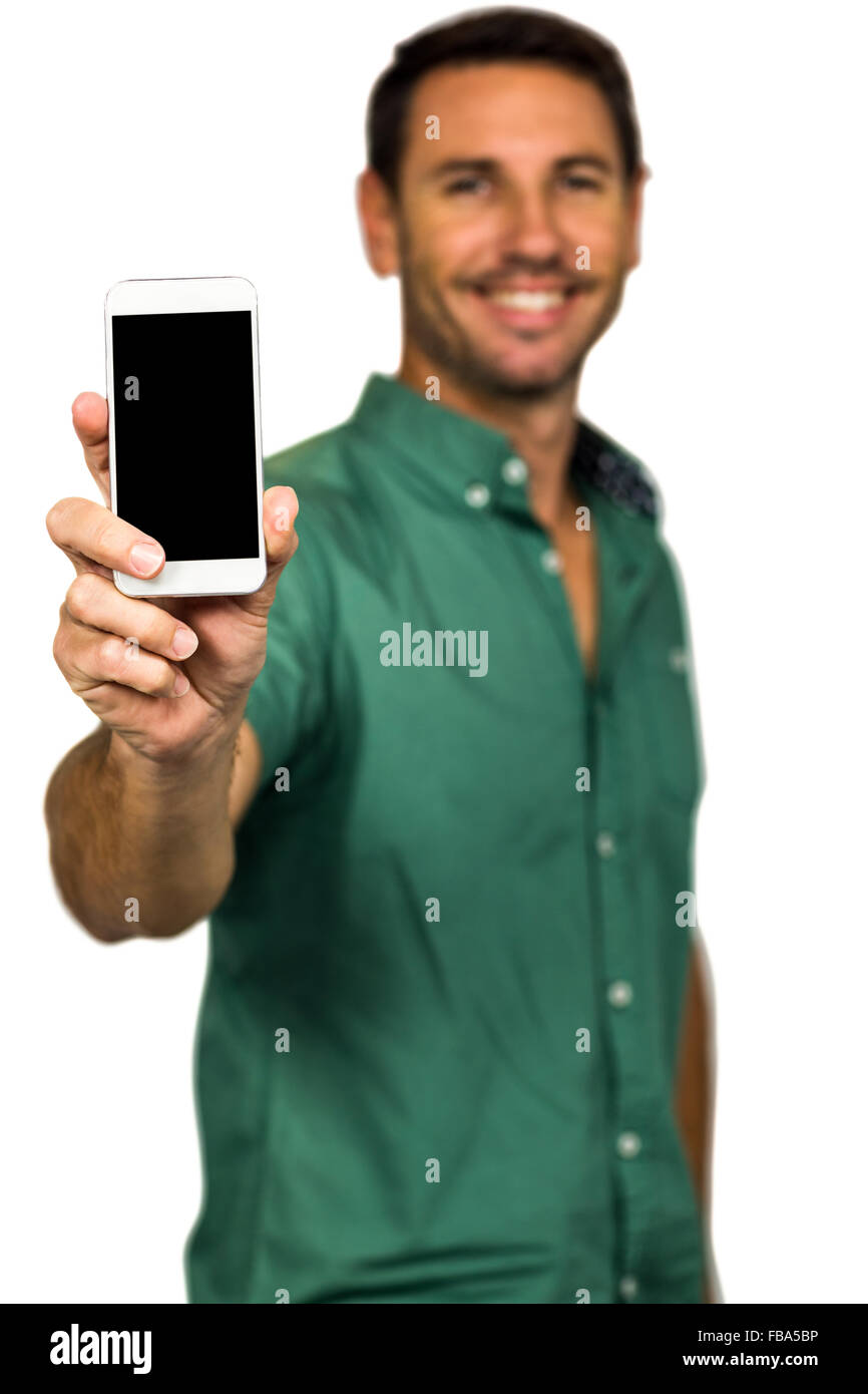 Smiling man showing smartphone screen Stock Photo - Alamy