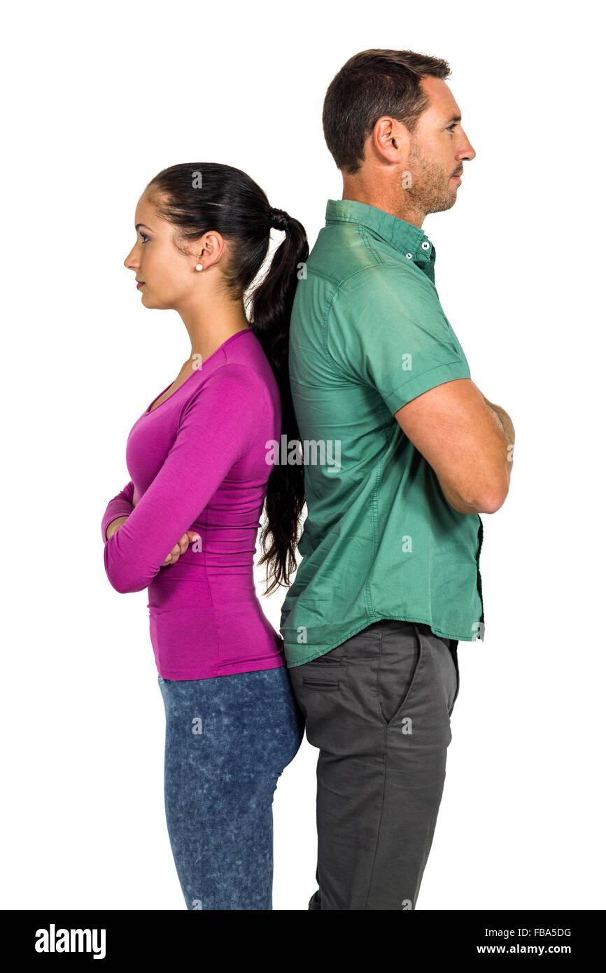 Couple standing back to back Stock Photo - Alamy