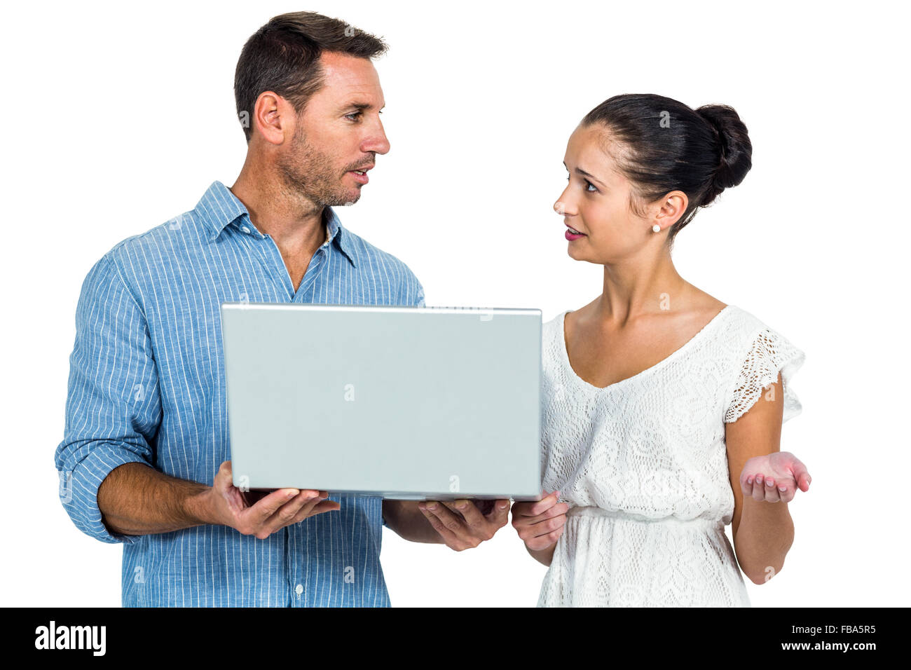 Worried couple using laptop Stock Photo - Alamy