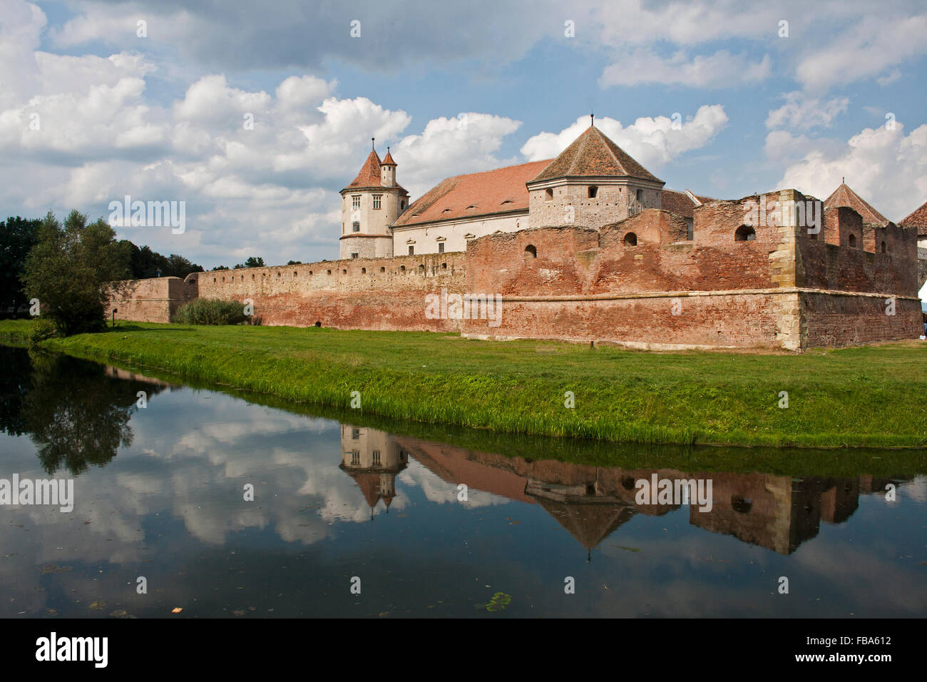 Famous Fagaras medieval castle in Transylvania reflection Stock Photo ...