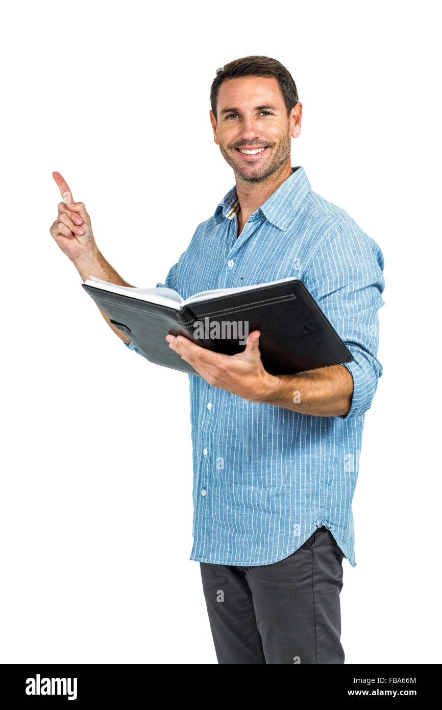 Man holding book hi-res stock photography and images - Alamy
