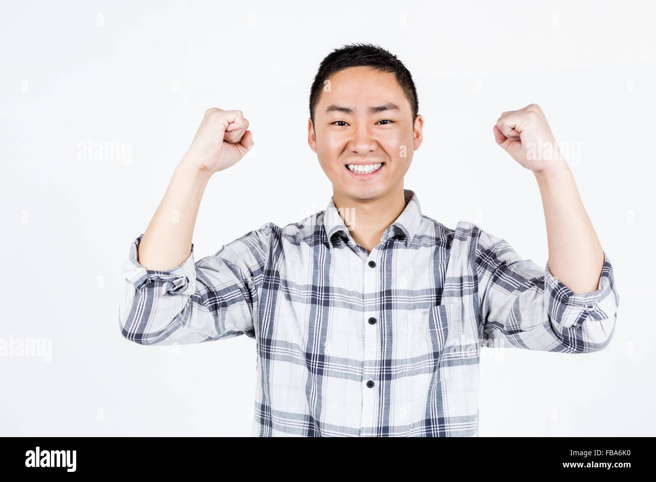 Happy man showing wining gesture Stock Photo - Alamy