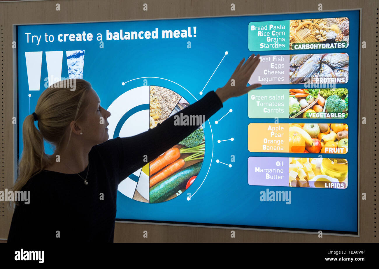 A Nestle employee shows a possible combination for a balanced diet on a ...