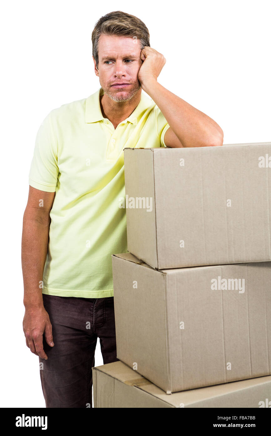Sad man standing by with boxes Stock Photo - Alamy