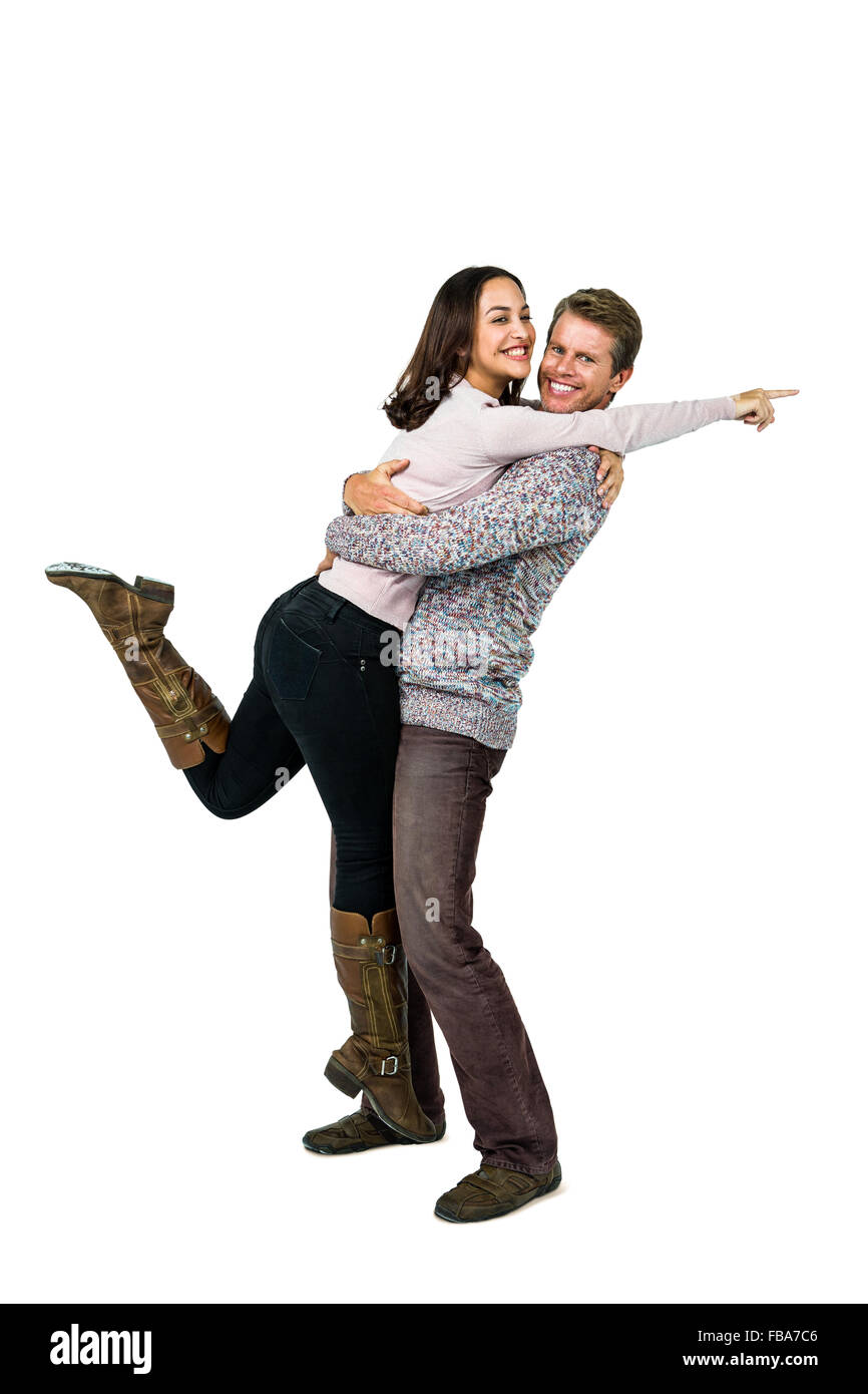 Smiling man lifting woman Stock Photo - Alamy