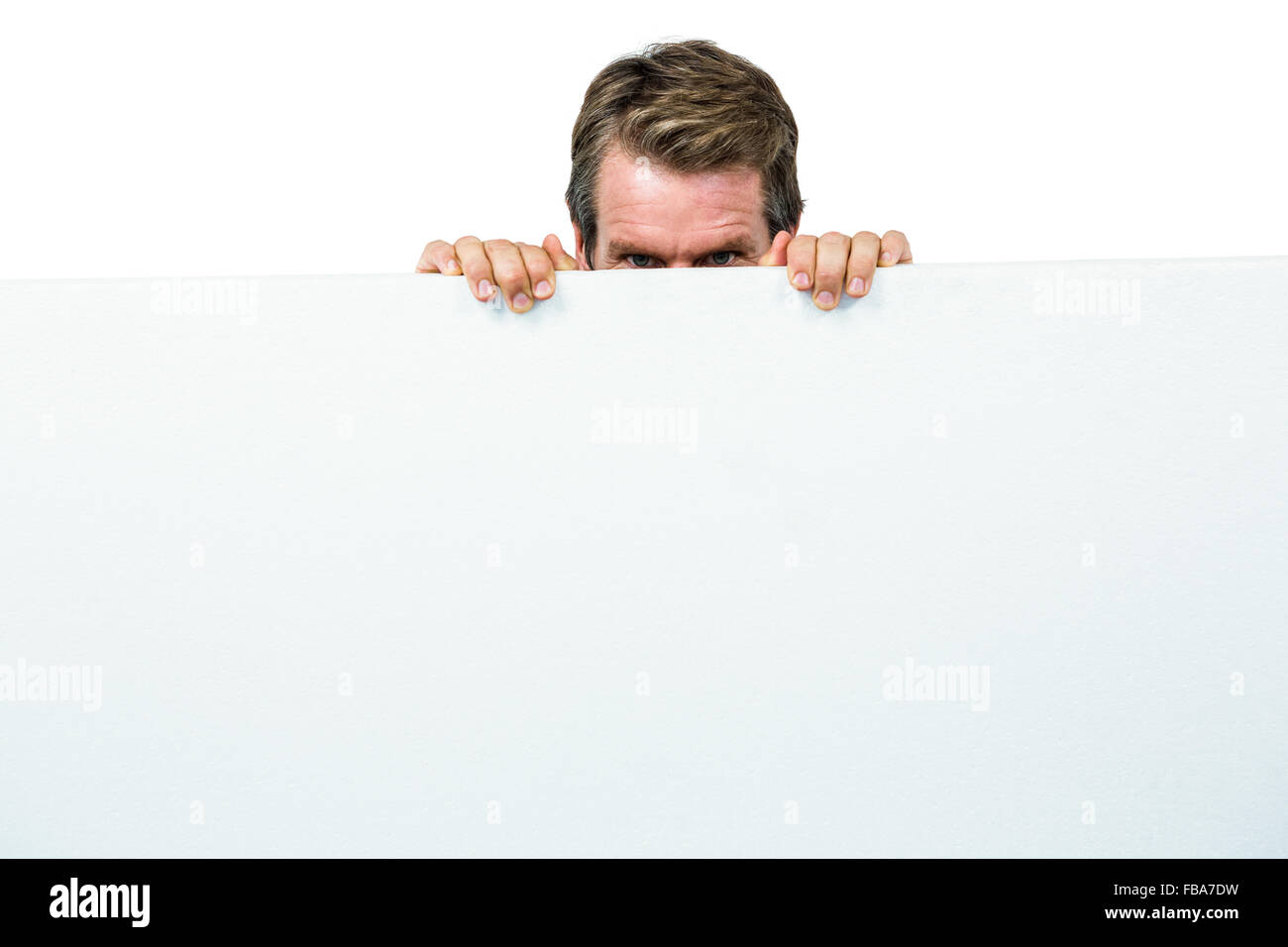 Man hiding behind board Stock Photo - Alamy