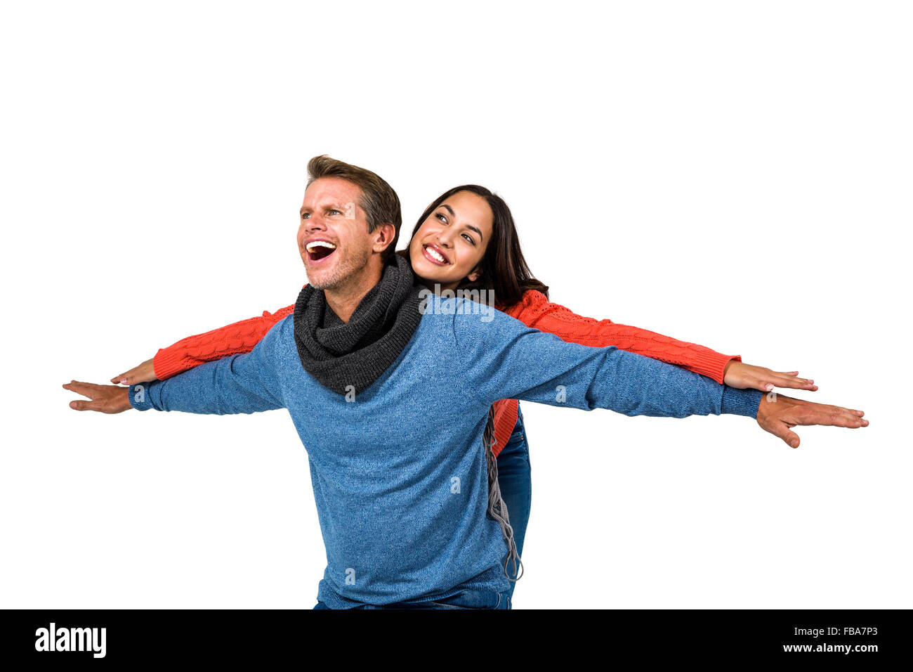 Happy couple with arms outstretched Stock Photo - Alamy