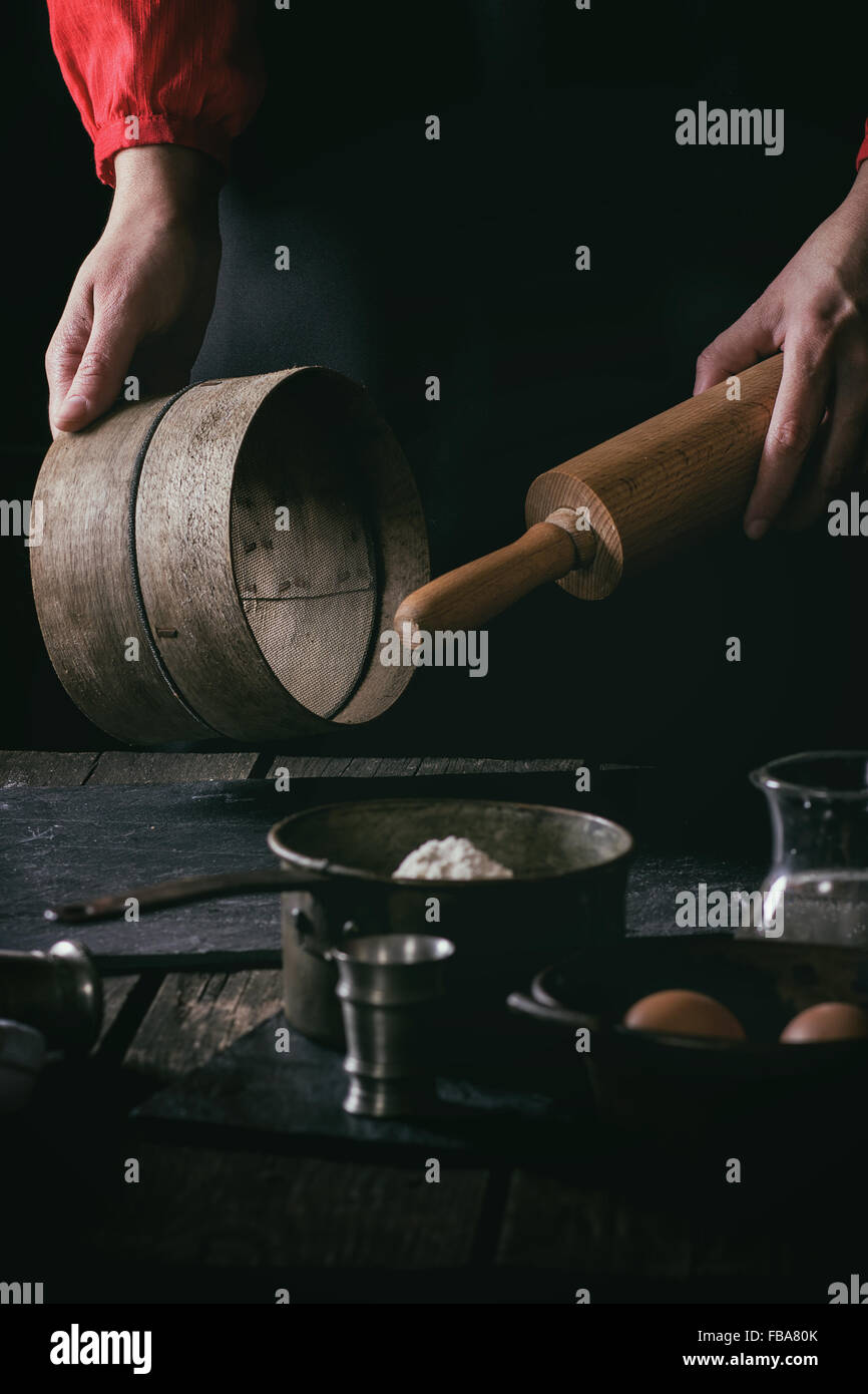 Female hands with wooden rolling-pin and sieve Stock Photo - Alamy