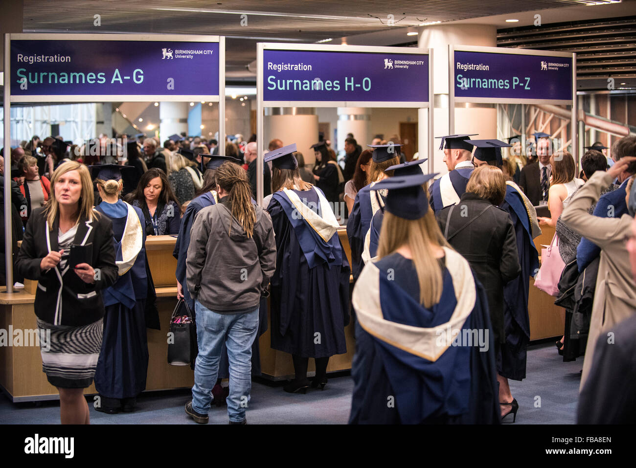 Registration in foyer for graduation ceremony Stock Photo - Alamy