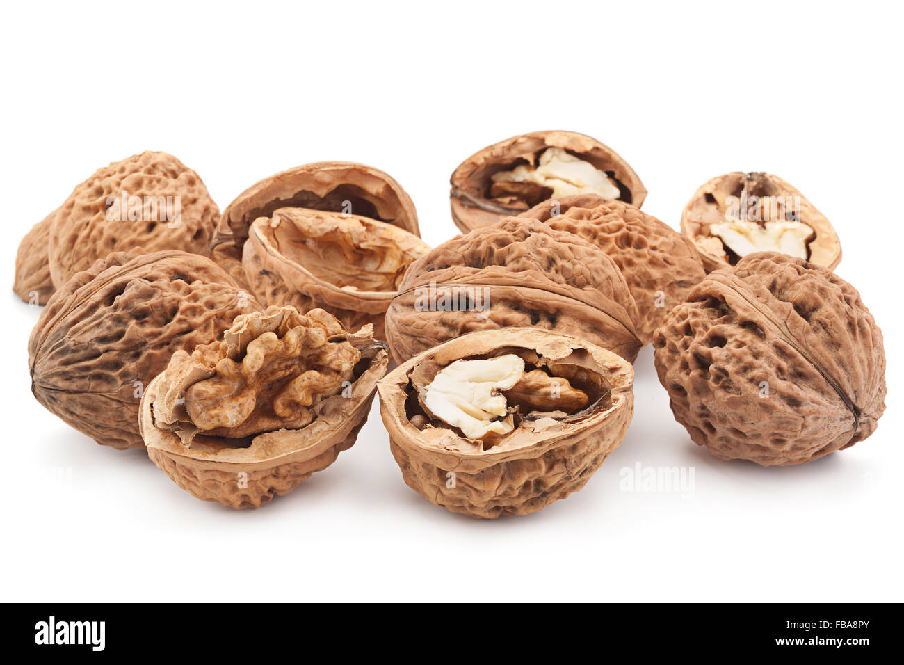 Walnut fruit group closeup isolated on white Stock Photo - Alamy