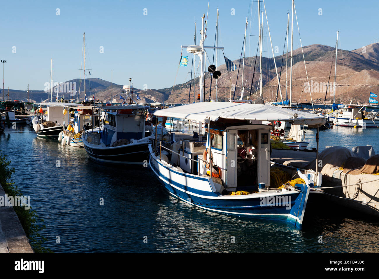 Traditional Greek fishing boats harbored at Lixouri during the day ...