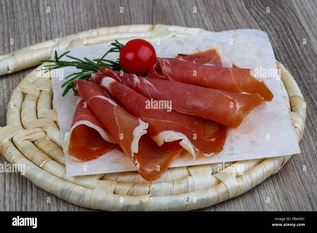 Spanish traditional snack - Jamon with tomato and rosemary Stock Photo ...