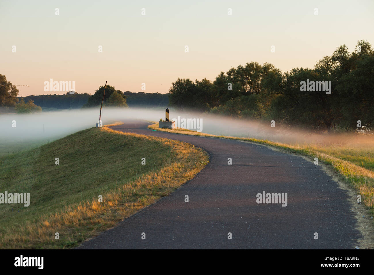 Layer of morning fog (Marine layer) cascading over walking path ...