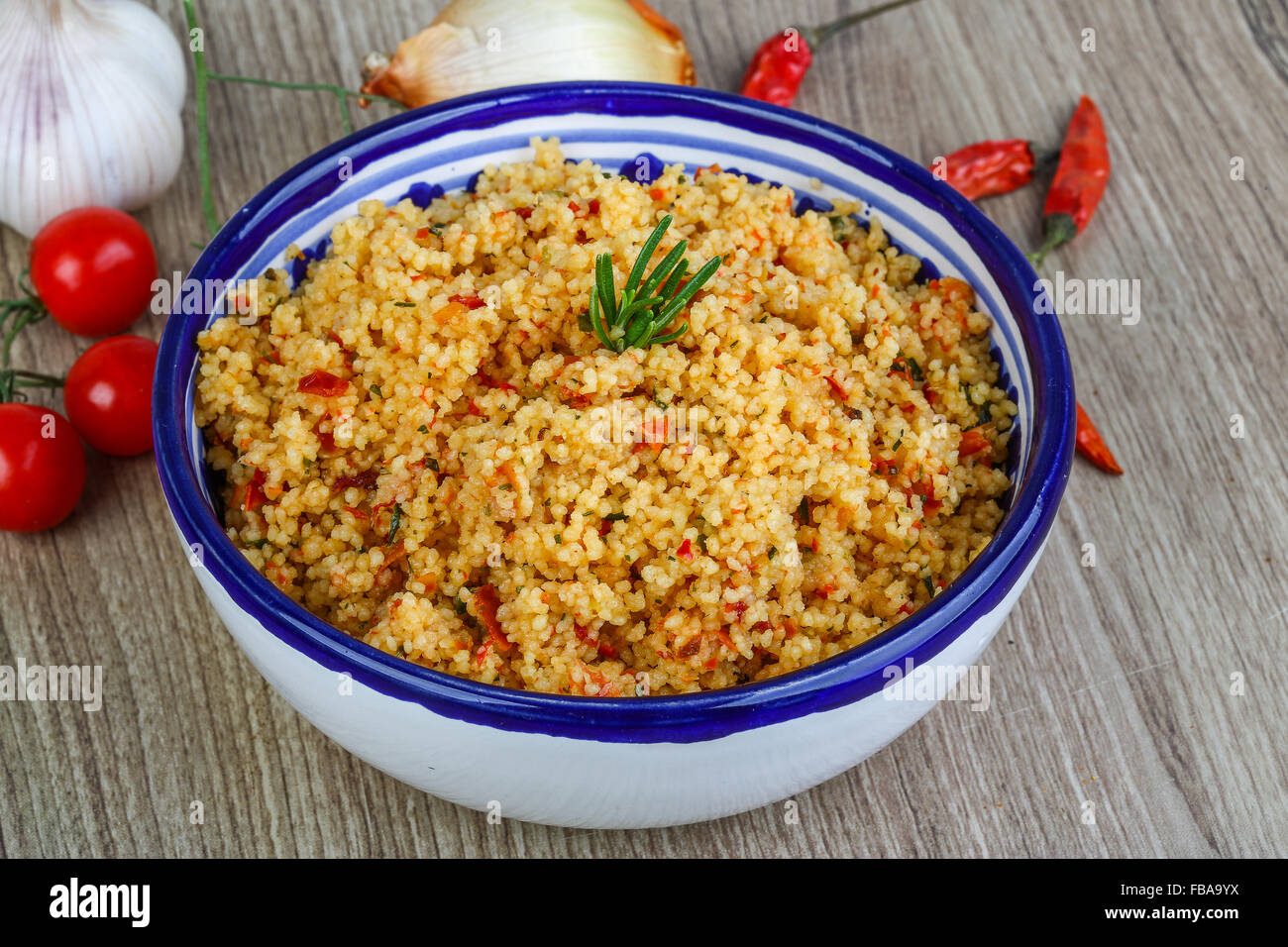 Arabic traditional cuisine - Couscous with tomato and green onion Stock ...