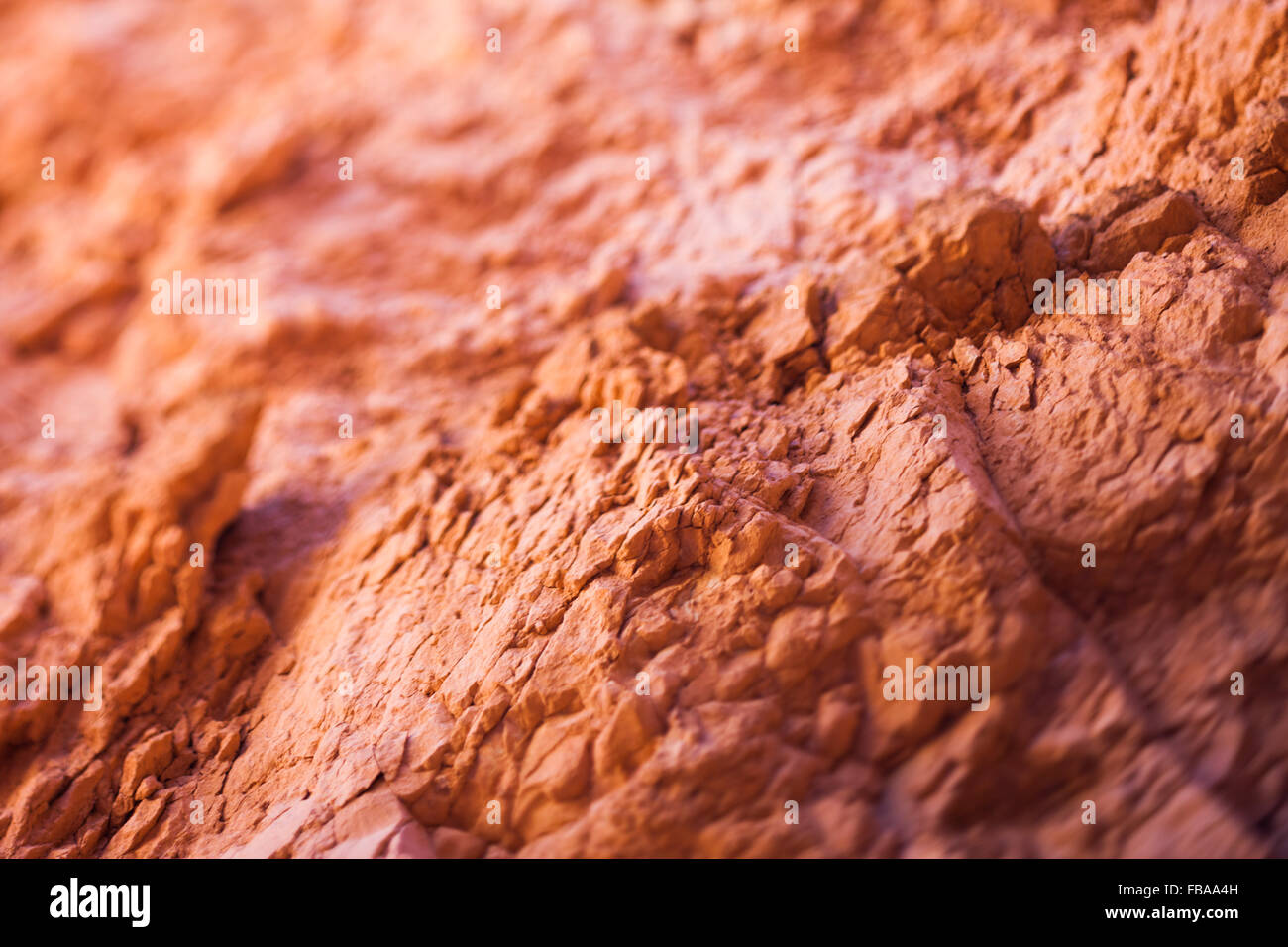 Red cracked and rough sandstone close up view Stock Photo - Alamy