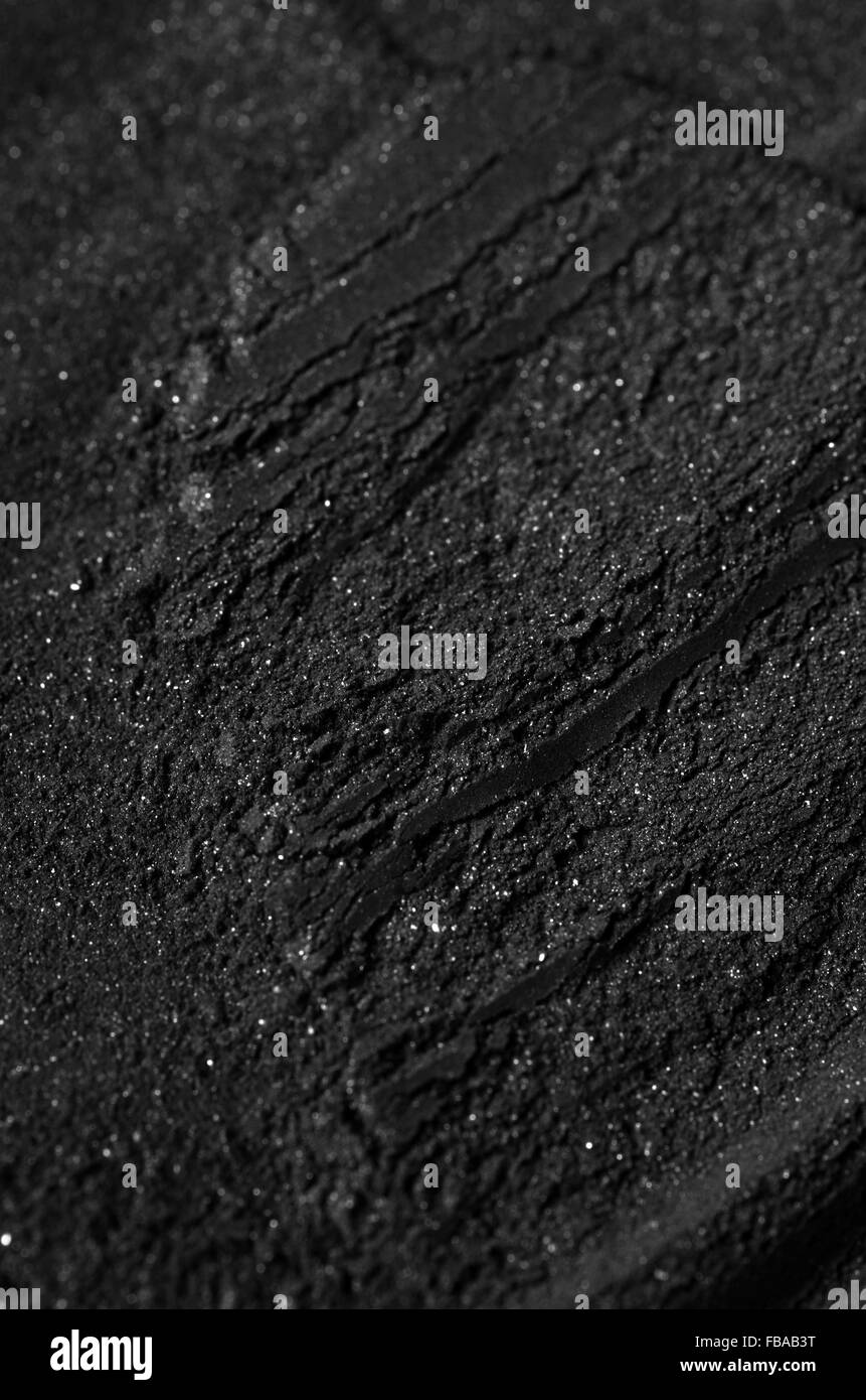 Activated charcoal powder shot with a macro lens Stock Photo - Alamy