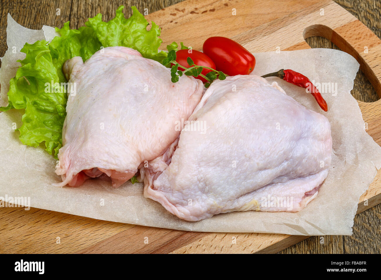 Raw chicken legs meat with herbs and spices ready for cooking Stock ...