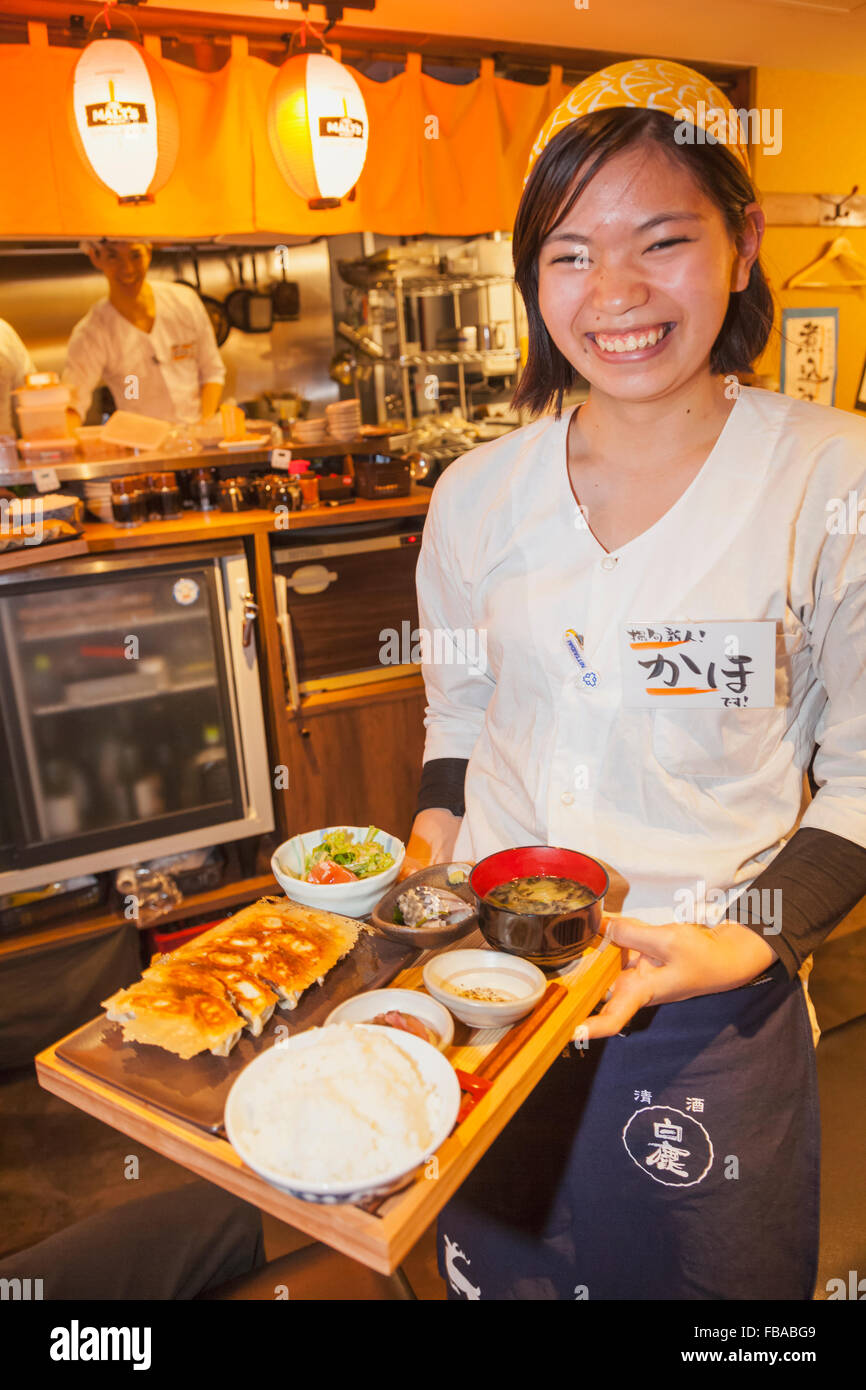 Japan, Honshu, Tokyo, Restaurant Waitress Serving Food Stock Photo - Alamy