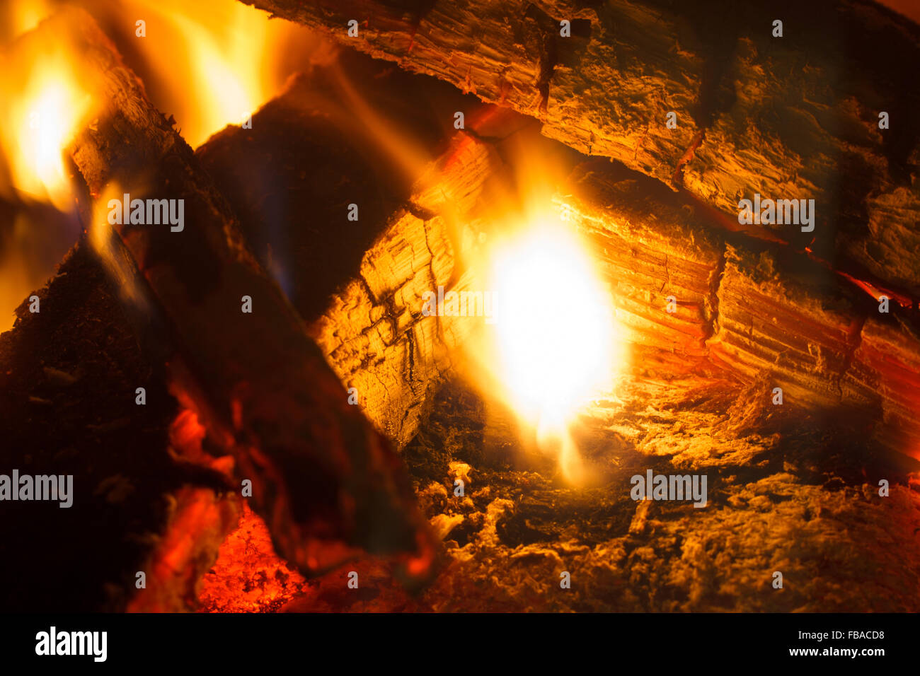 Burning wood. Firewood in the fireplace Stock Photo - Alamy