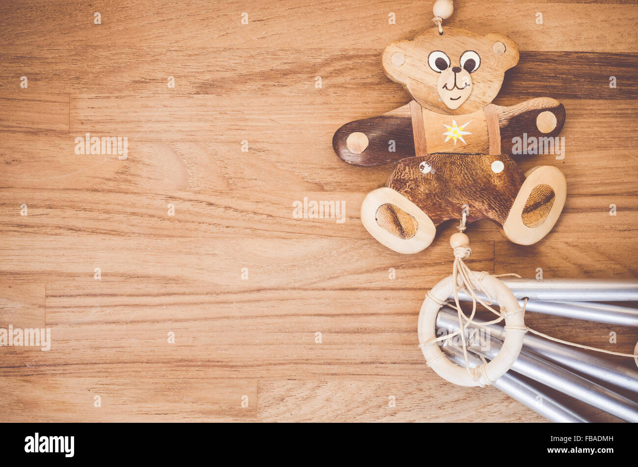 hand made wood teddy bear on a natural wood background Stock Photo - Alamy