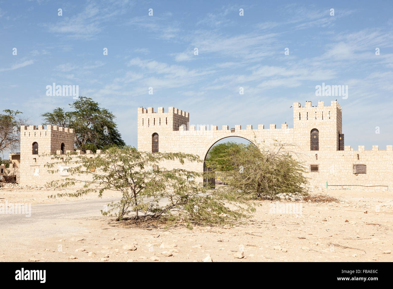 Farm gate with traditional arabic towers in the desert of Qatar, Middle ...
